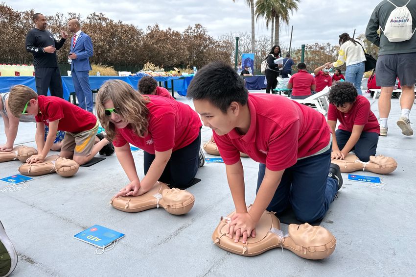 Photo | Hands-Only CPR training at swim safety event | American Heart ...