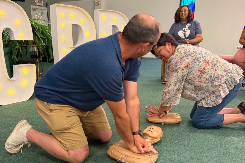 Photo | Participant Practicing Hands Only CPR Compressions | American ...
